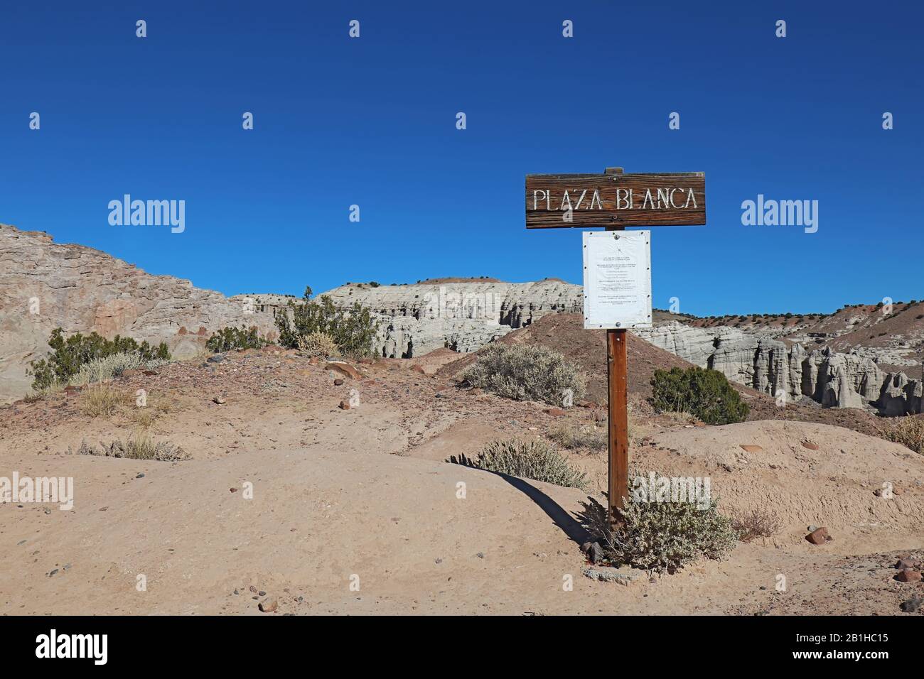 Sign at the entrance to the hiking trails and dramatic white sandstone ...