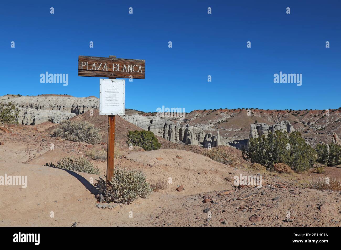 Sign at the entrance to the hiking trails and dramatic white sandstone ...