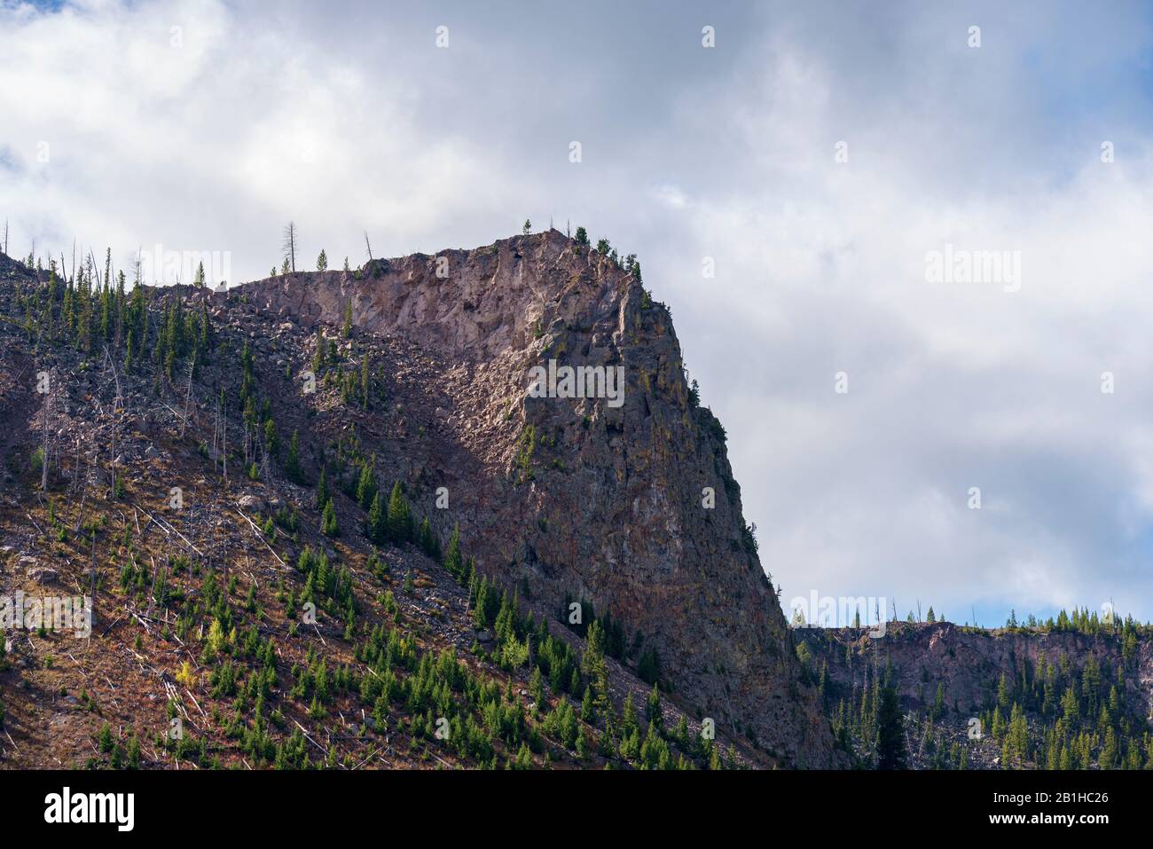 Steep mountain face with trees and vegetation on slopes Stock Photo - Alamy