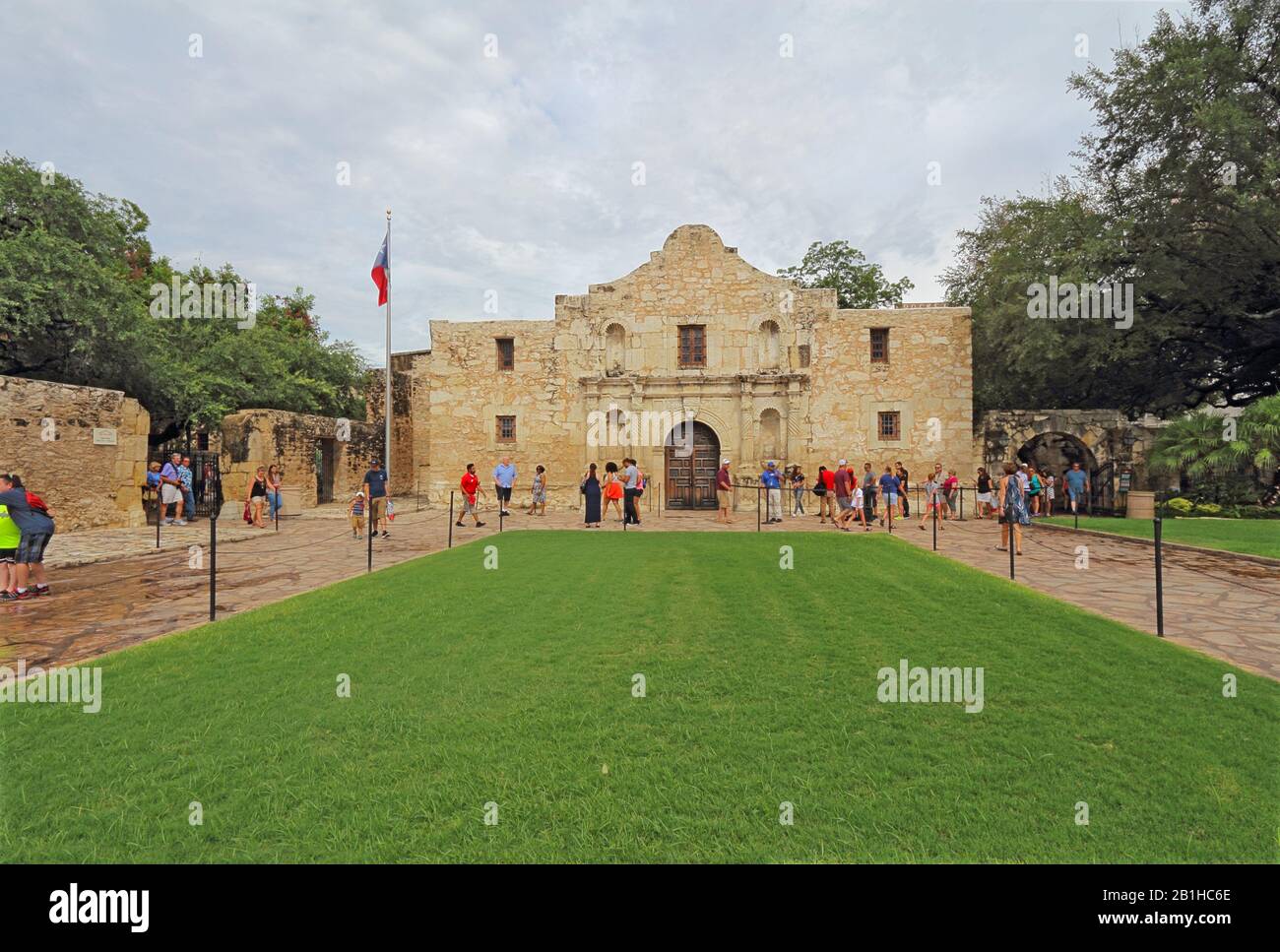 Tourists visiting the chapel at the Alamo Mission, the former Mision ...