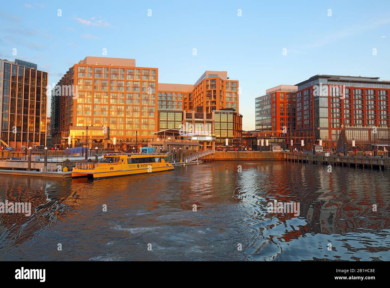 Water taxi at The Wharf, buildings and skyline at the newly redeveloped ...