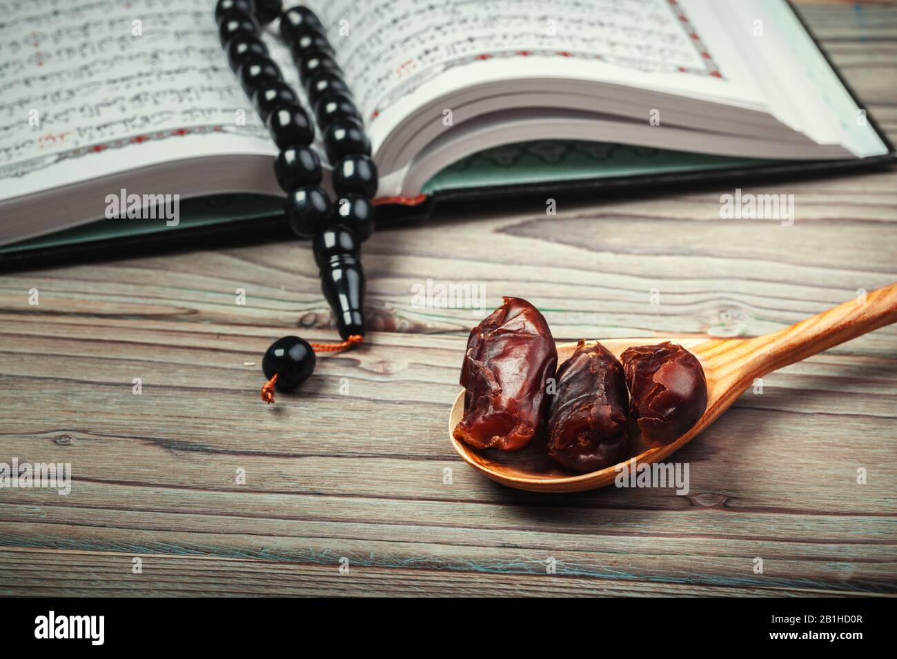 The Open holy Quran with tasbih rosary beads Stock Photo - Alamy