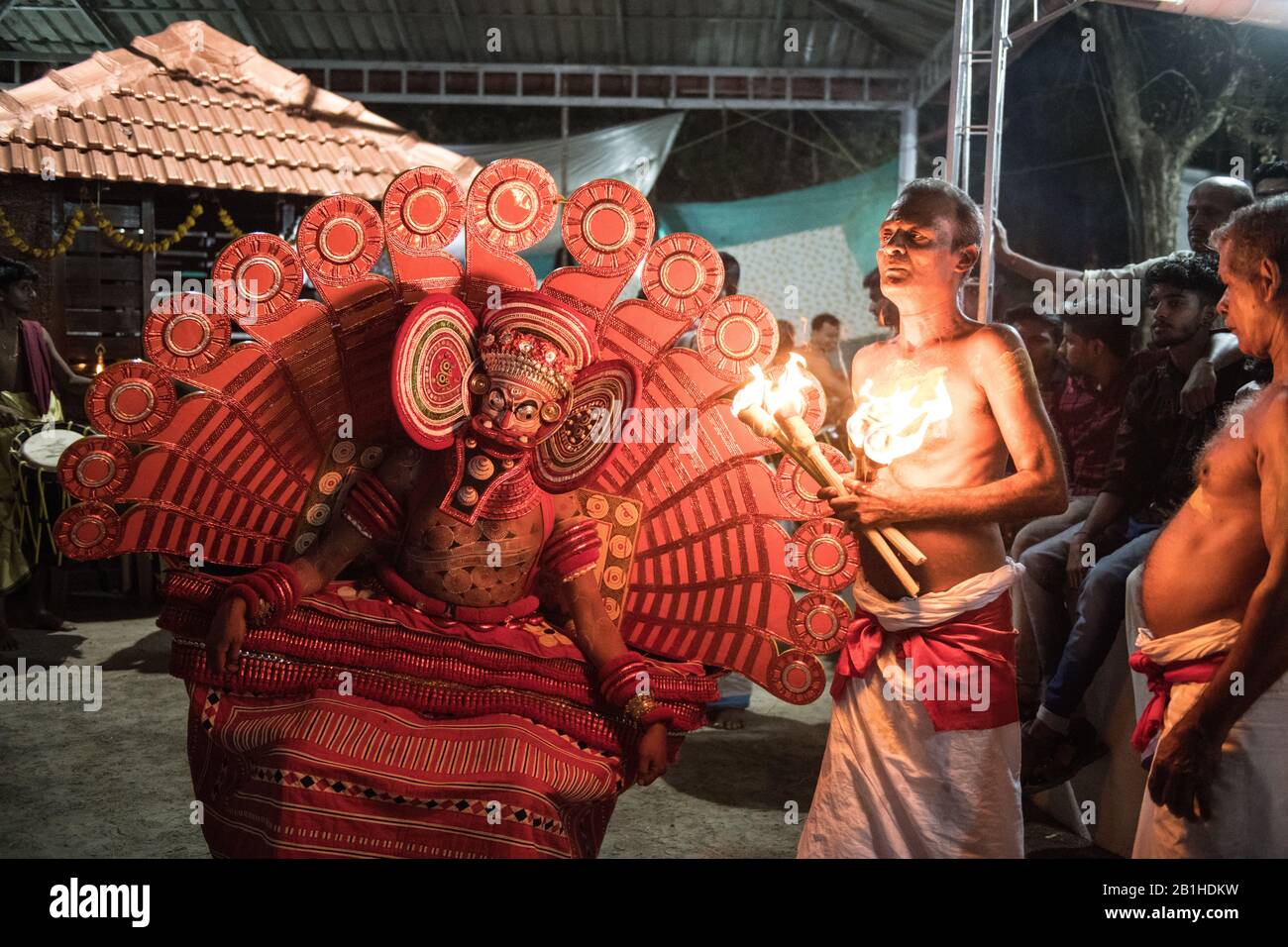 Theyyam performer, as a living god, dances a popular ritual form of ...