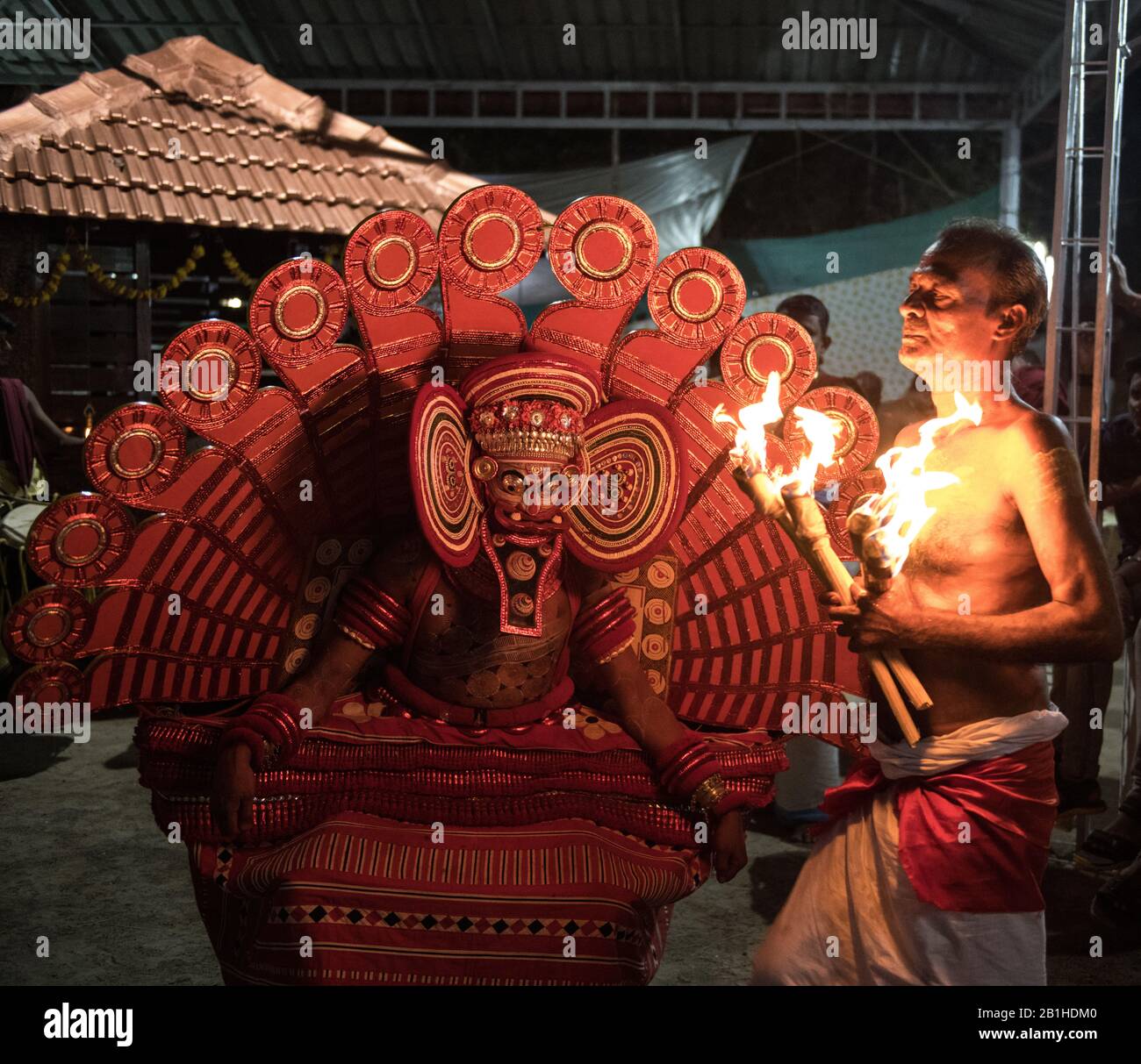 Theyyam performer, as a living god, dances a popular ritual form of ...