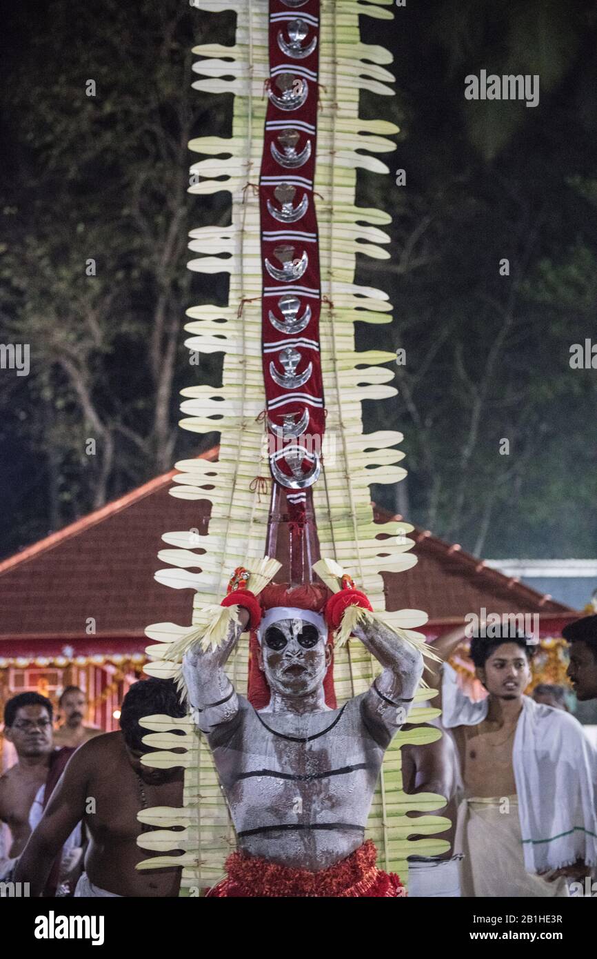 Theyyam performer, as a living god, dances a popular ritual form of ...