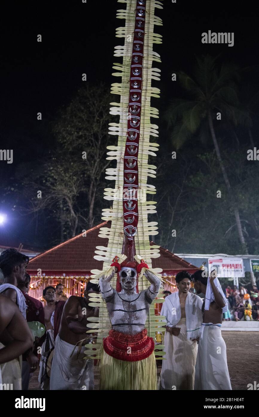 Theyyam performer, as a living god, dances a popular ritual form of ...