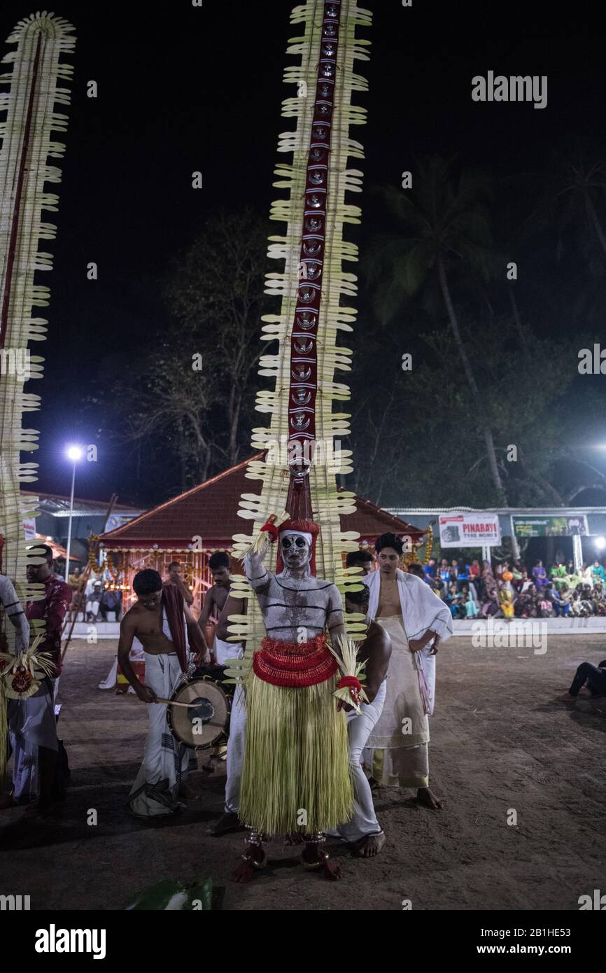 Theyyam performers dancing a popular ritual form of worship in North ...