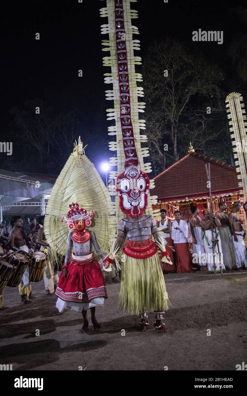 Theyyam performers dancing a popular ritual form of worship in North ...