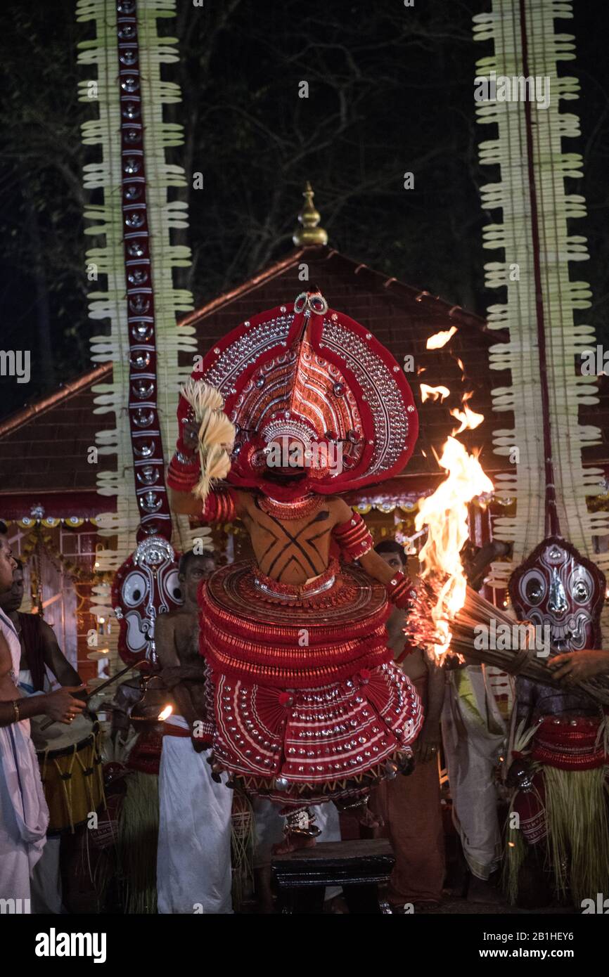 Theyyam performer, as a living god, dances a popular ritual form of ...