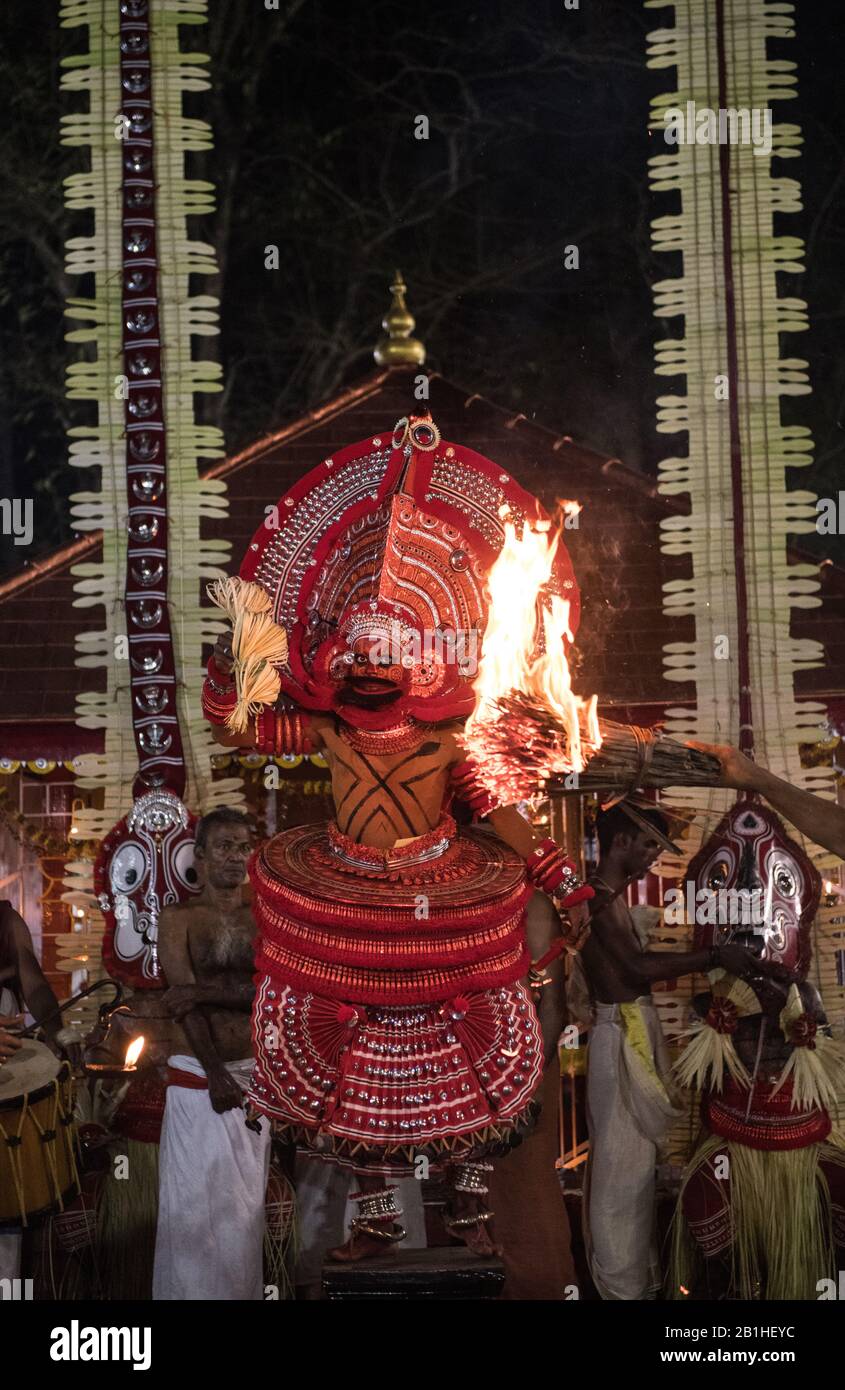 Theyyam performer, as a living god, dances a popular ritual form of ...