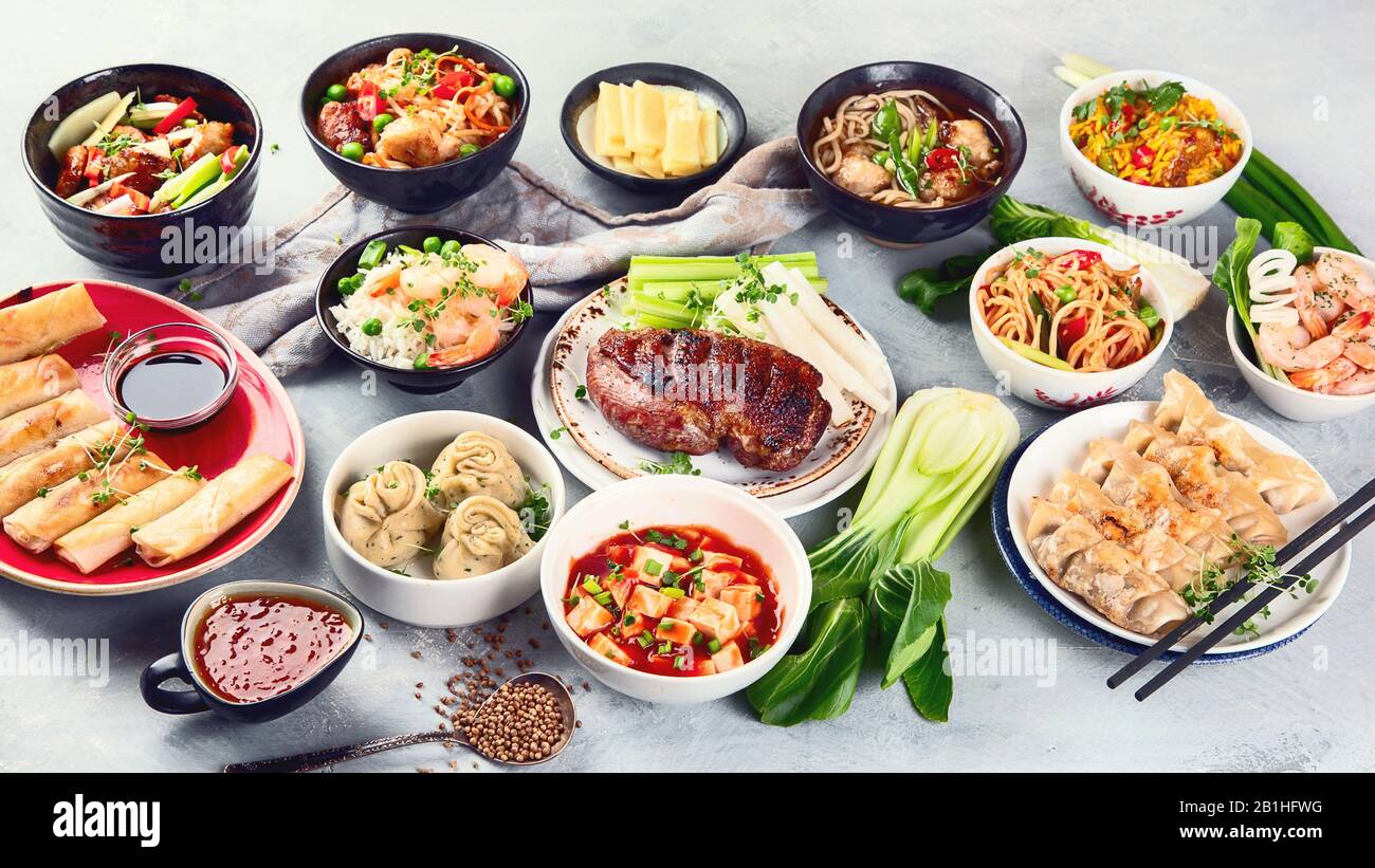 Assorted Chinese dishes on grey background. Asian food concept. Top ...