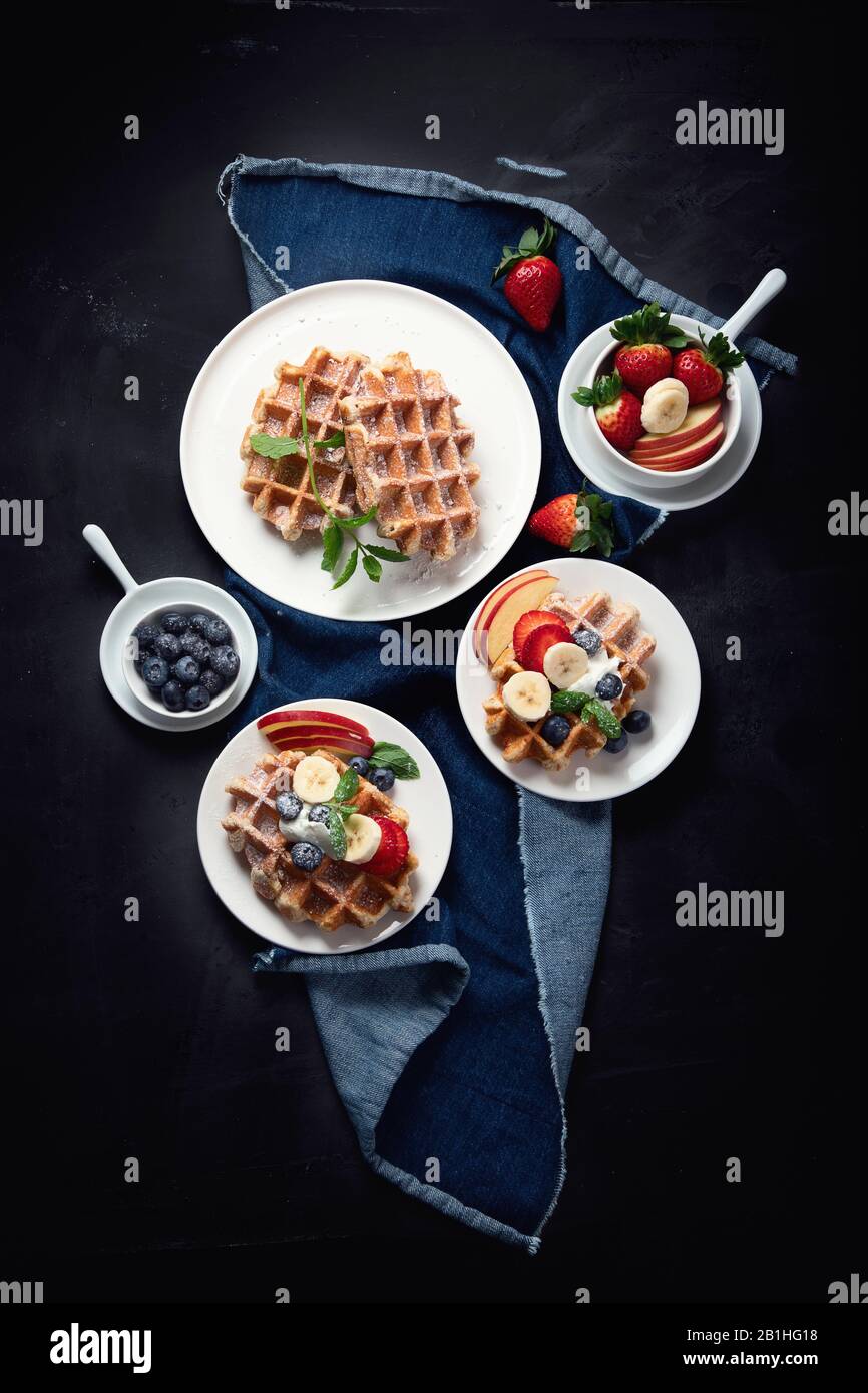 Traditional belgian waffles with fresh berries and fruits for breakfast ...