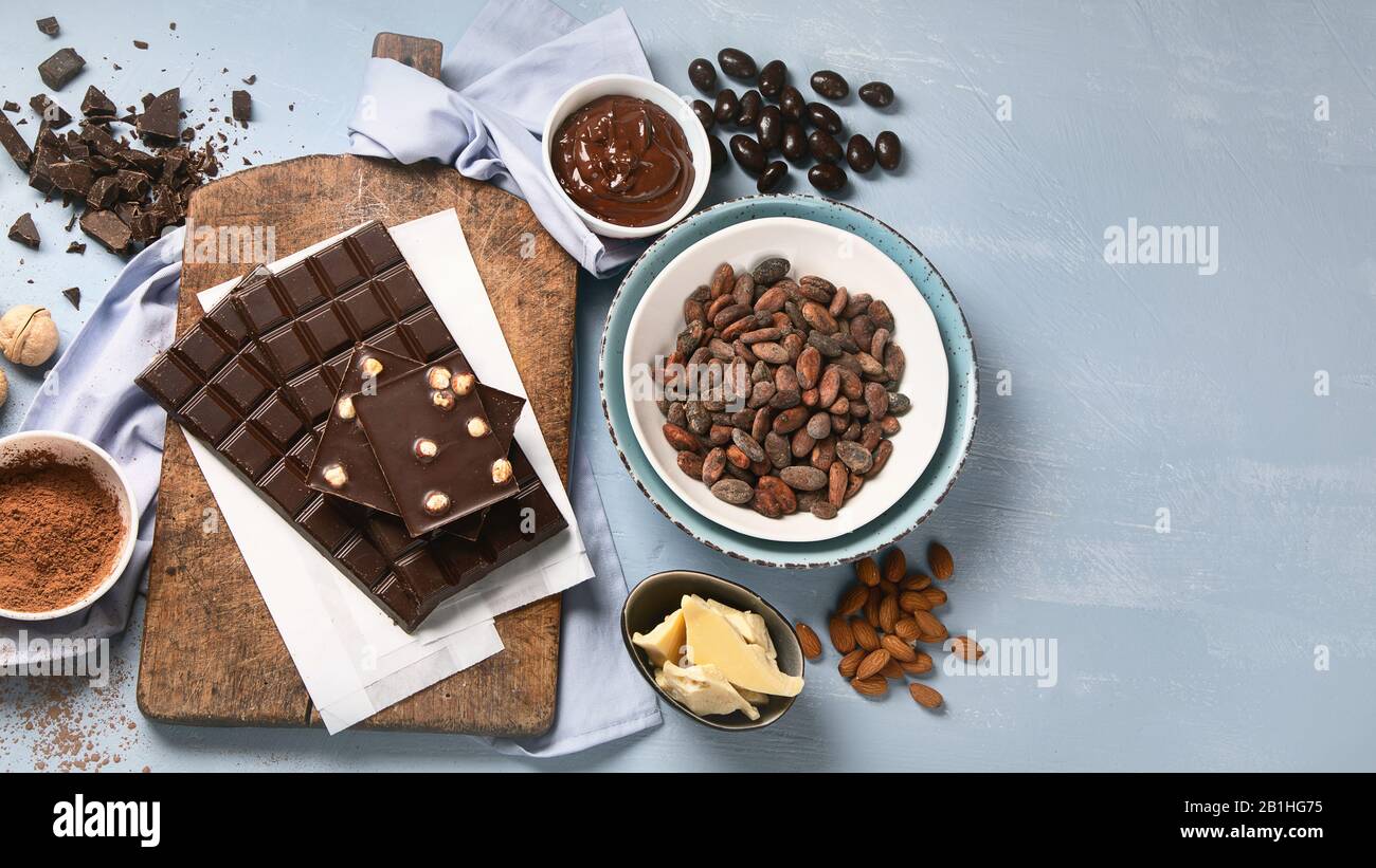 Dark bitter chocolate bars, cacao butter, cacao powder and cocoa beans ...