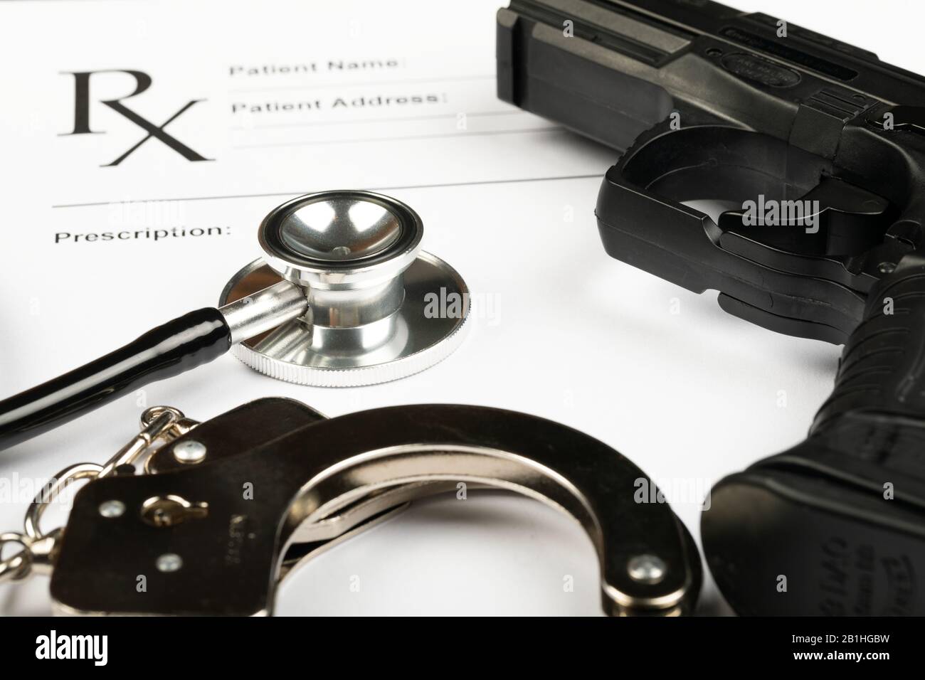 Picture of a medical prescription, handgun and handcuffs Stock Photo ...
