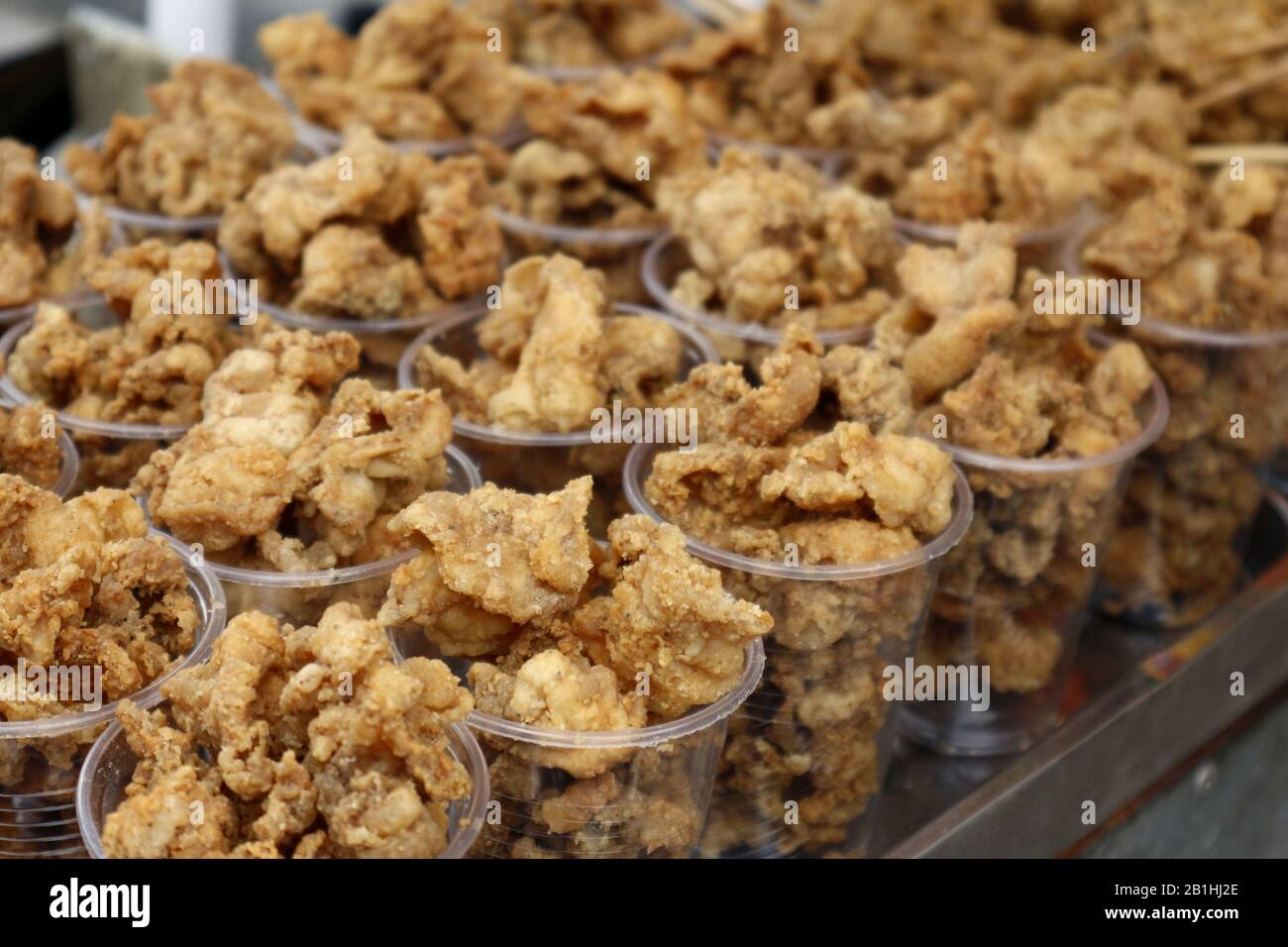 Photo of fried crispy chicken skin and intestine sold as street food in ...