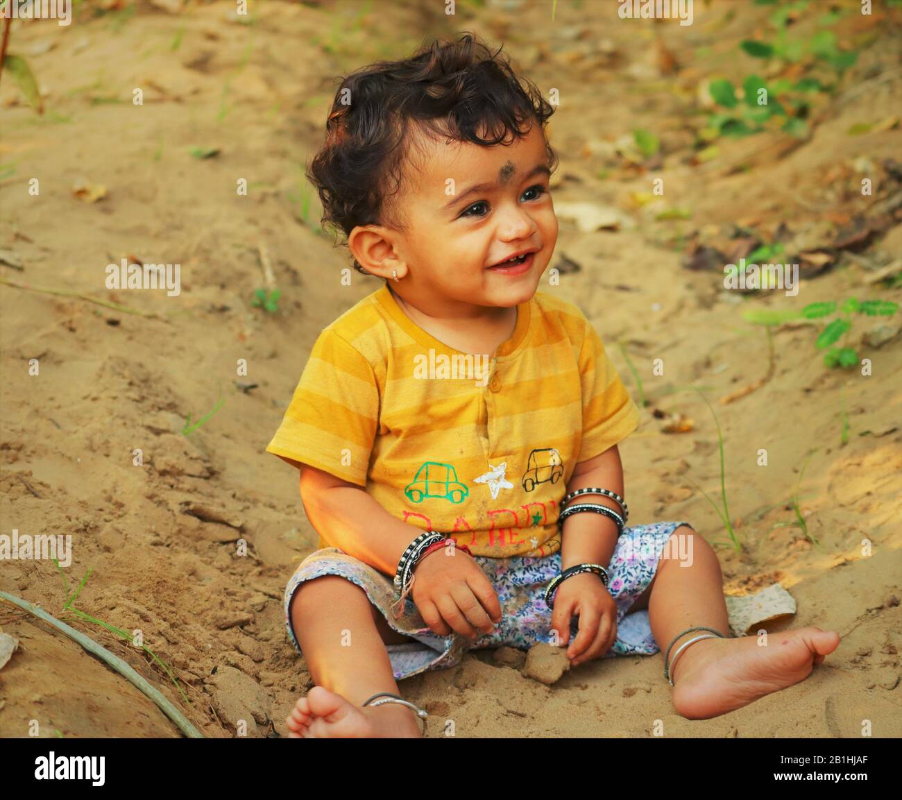 Shallow DOF of asian child in a dreamy position .Outdoor portrait of a ...