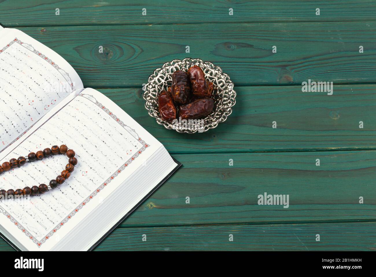 The Open holy Quran with tasbih rosary beads Stock Photo - Alamy