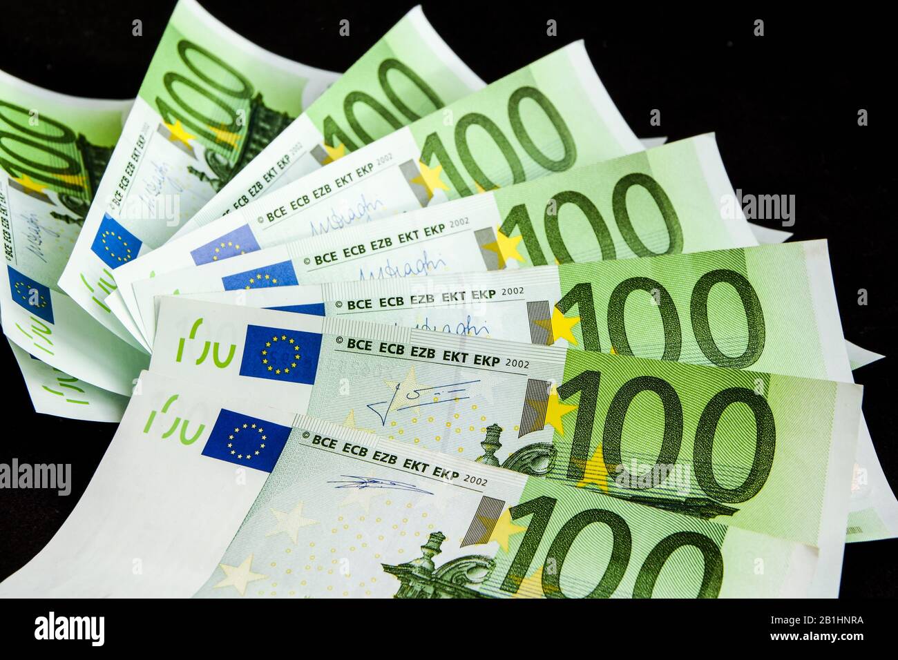 100 Euro - full set of banknotes of euro isolated on black Stock Photo ...