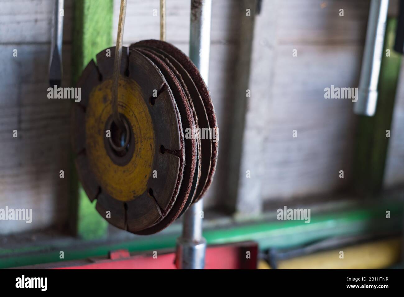 Circular wire grinding brush machine. Steel polisher in garage Stock ...