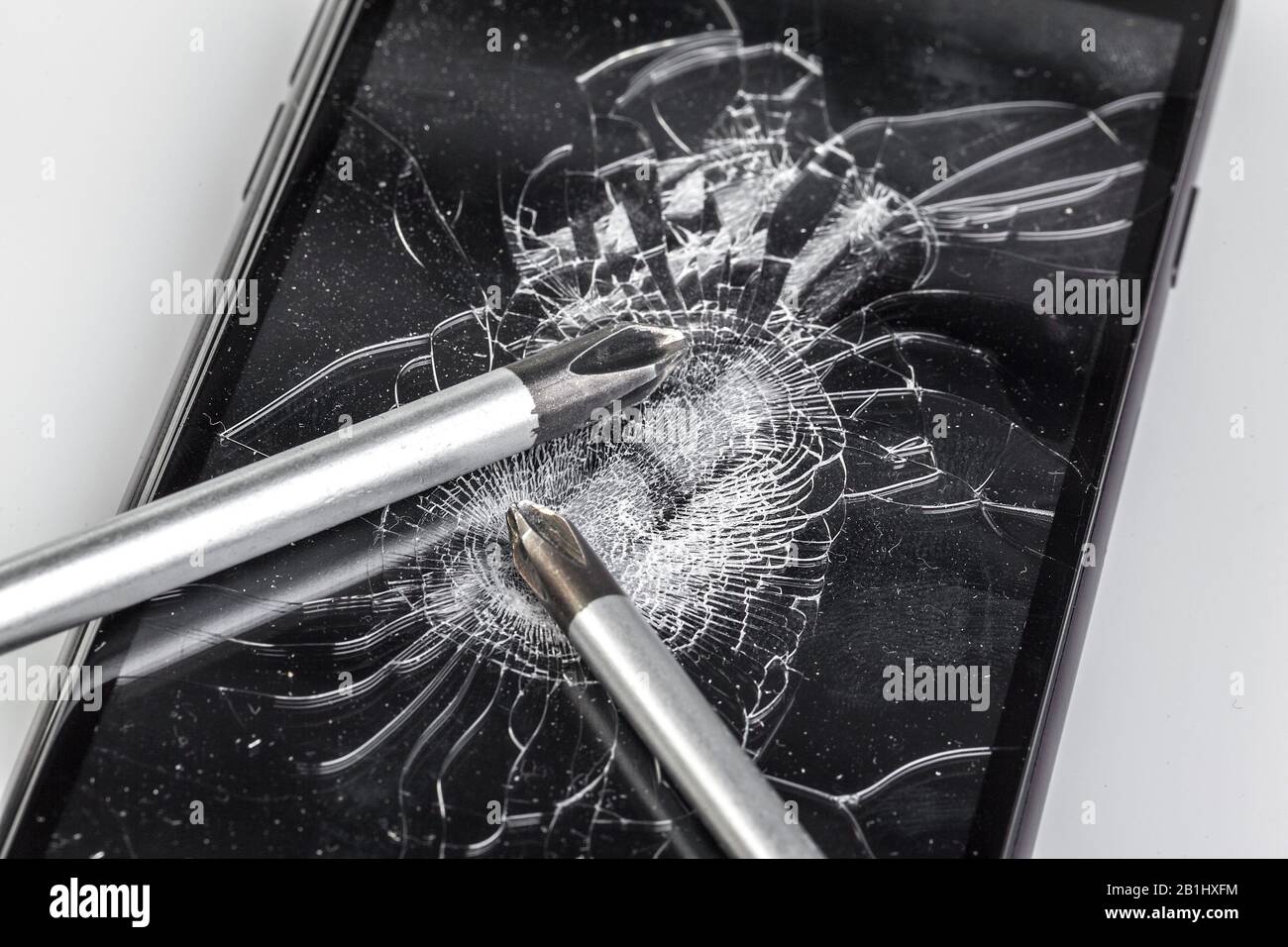 Mobile phone with broken screen. Creative photo Stock Photo - Alamy