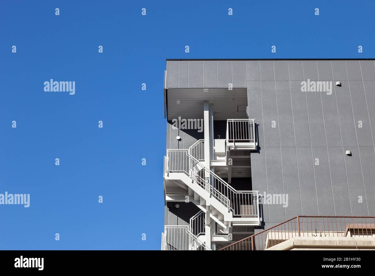 Metal fire escape outside apartment building for emergency Stock Photo ...