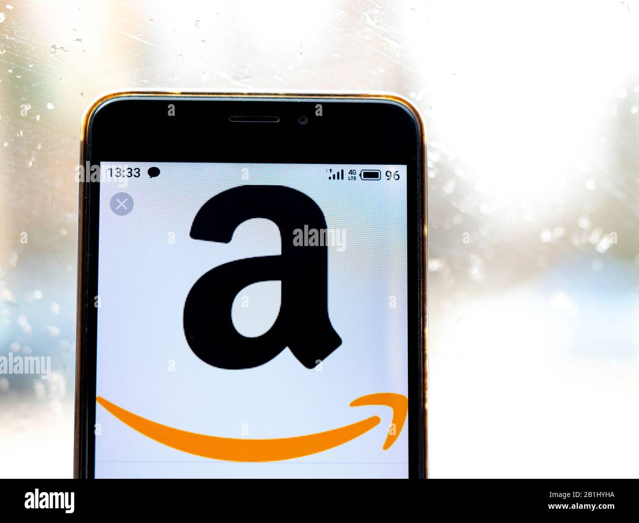 In this photo illustration the Amazon logo is seen displayed on a ...