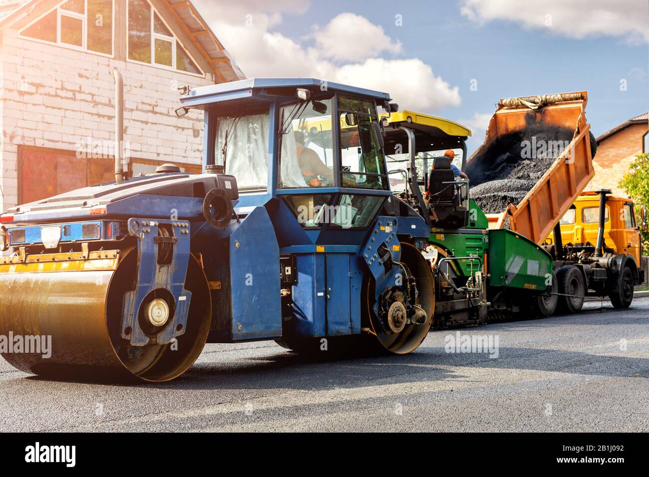 Asphalt higway road construction site. Heavy industrial machinery at ...