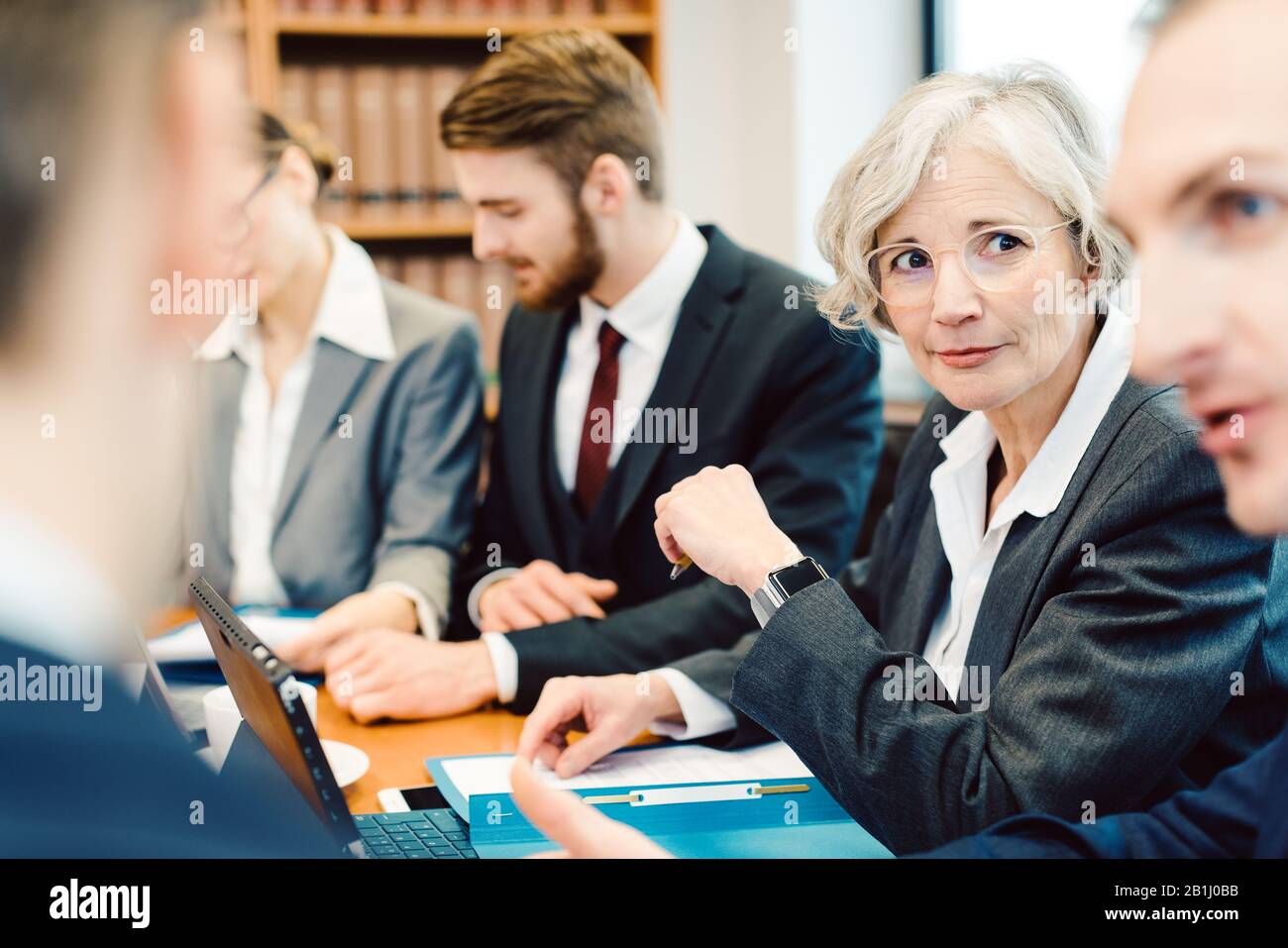 Business team working on some exciting project Stock Photo - Alamy