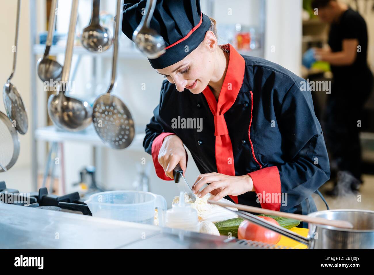 Chef cutting cauliflower Stock Photo - Alamy