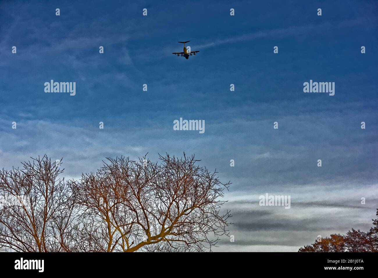 Airplane flying in Sky Stock Photo - Alamy
