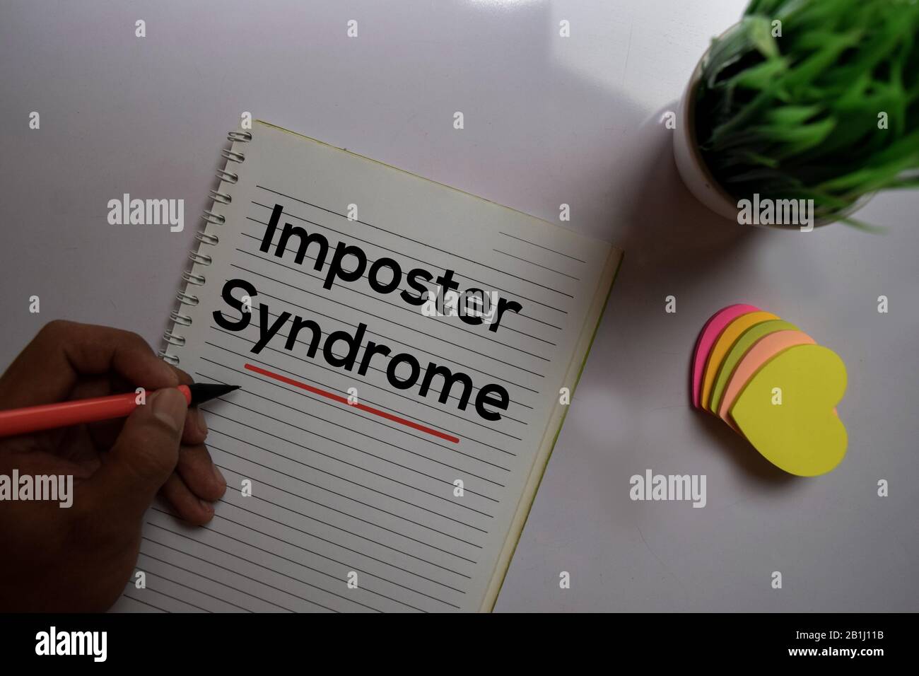 Imposter Syndrome text on sticky notes isolated on office desk Stock ...