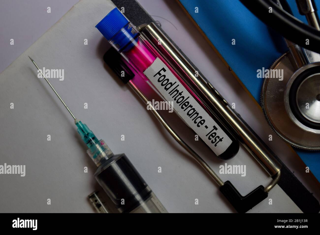 Food Intolerance - Test with blood sample. Top view isolated on office ...