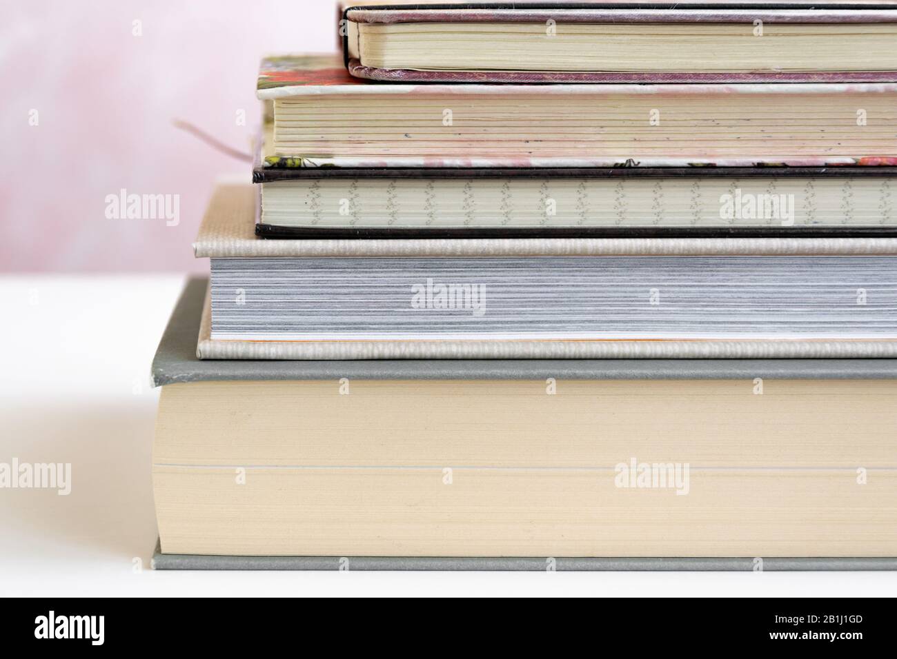 Stack of books tied with a bow Stock Photo - Alamy