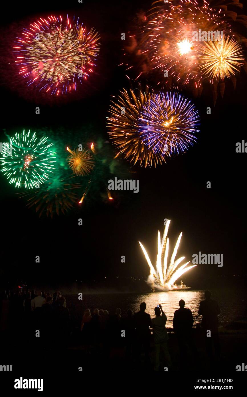 people looking at fireworks Stock Photo - Alamy