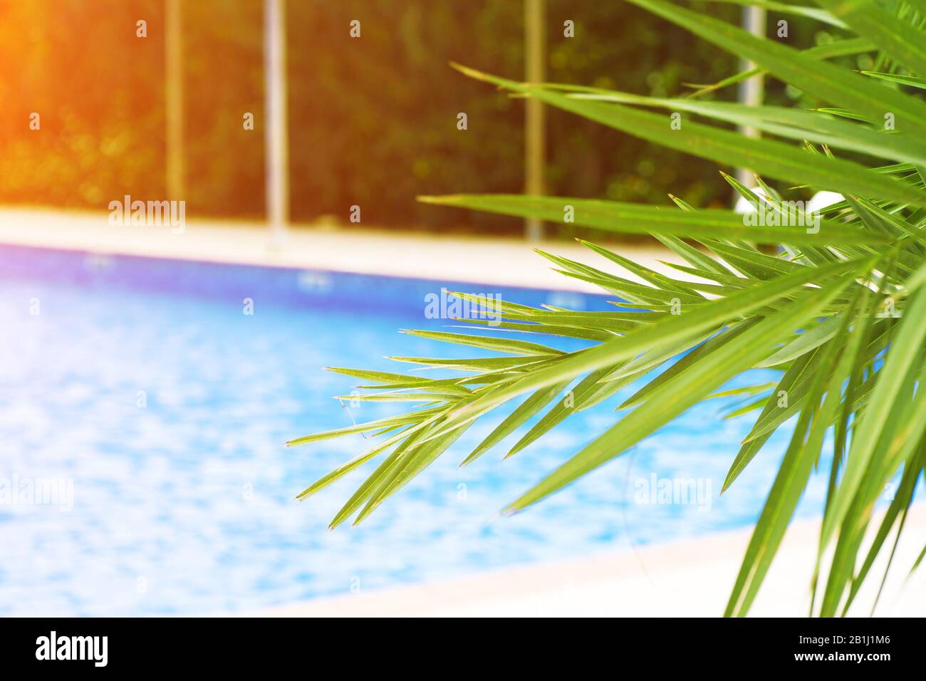 Outdoor swimming pool at summer time Stock Photo - Alamy