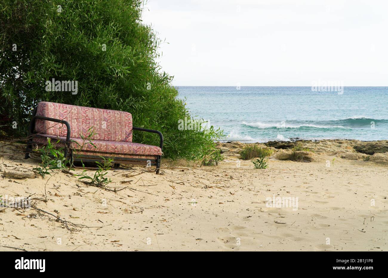 Old sofa on the sea beach Stock Photo - Alamy