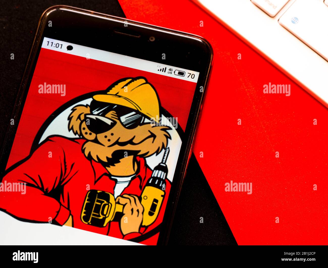 In this photo illustration the Acme Tools logo is seen displayed on a ...