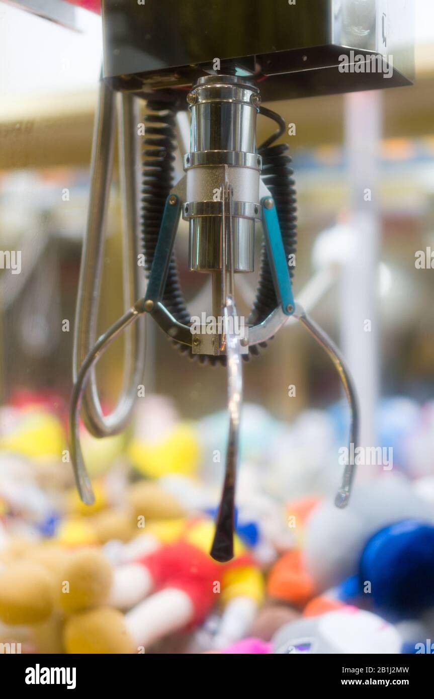 Mechanical claw game machine. Close-up view Stock Photo - Alamy