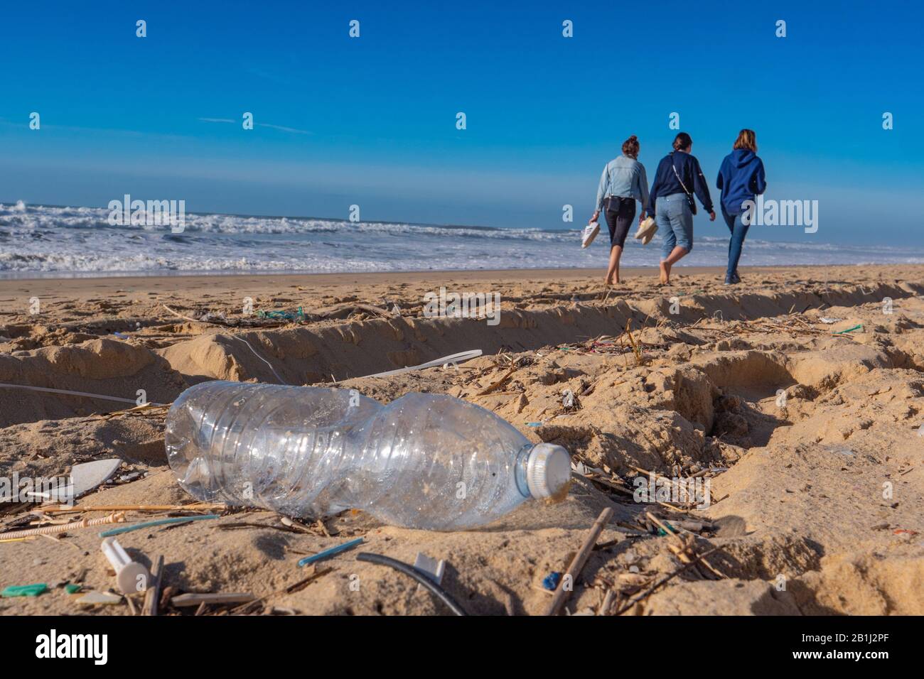 Plastic bottle on the beach, pollution Stock Photo - Alamy