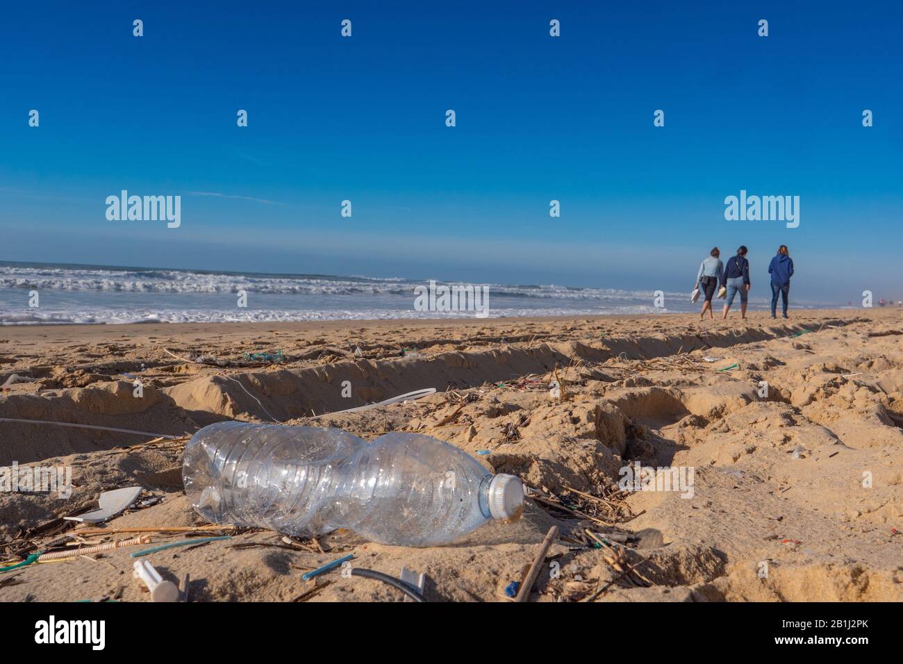 Plastic bottle on the beach, pollution Stock Photo - Alamy