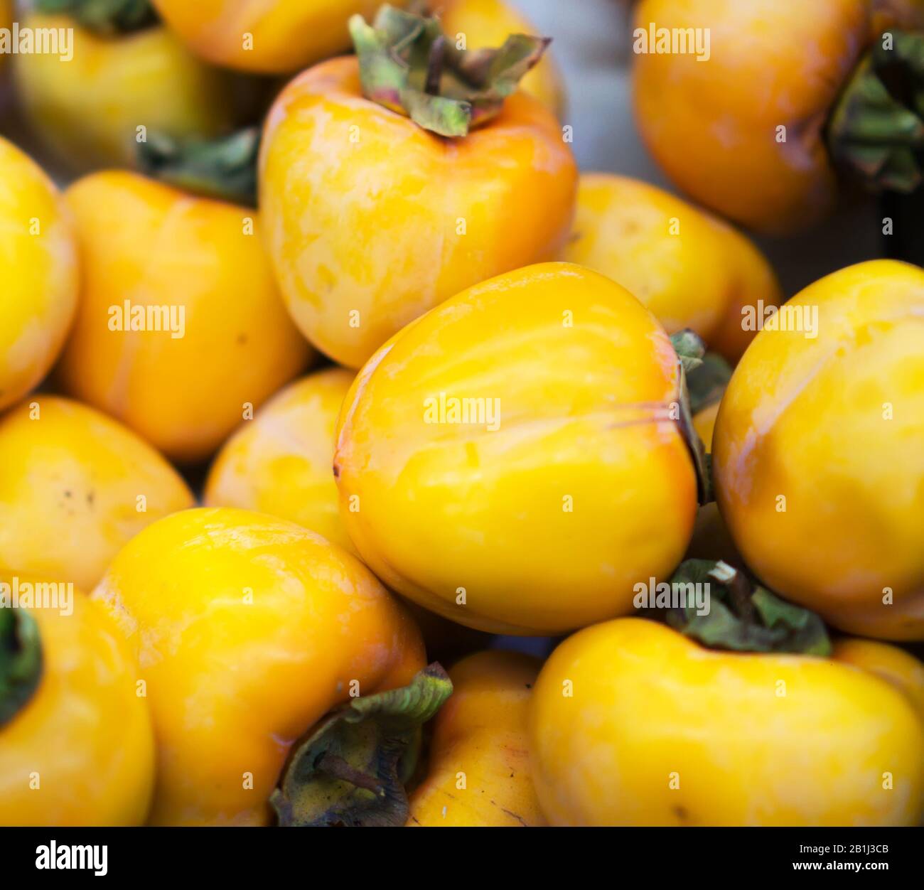 Organic persimmons hi-res stock photography and images - Alamy