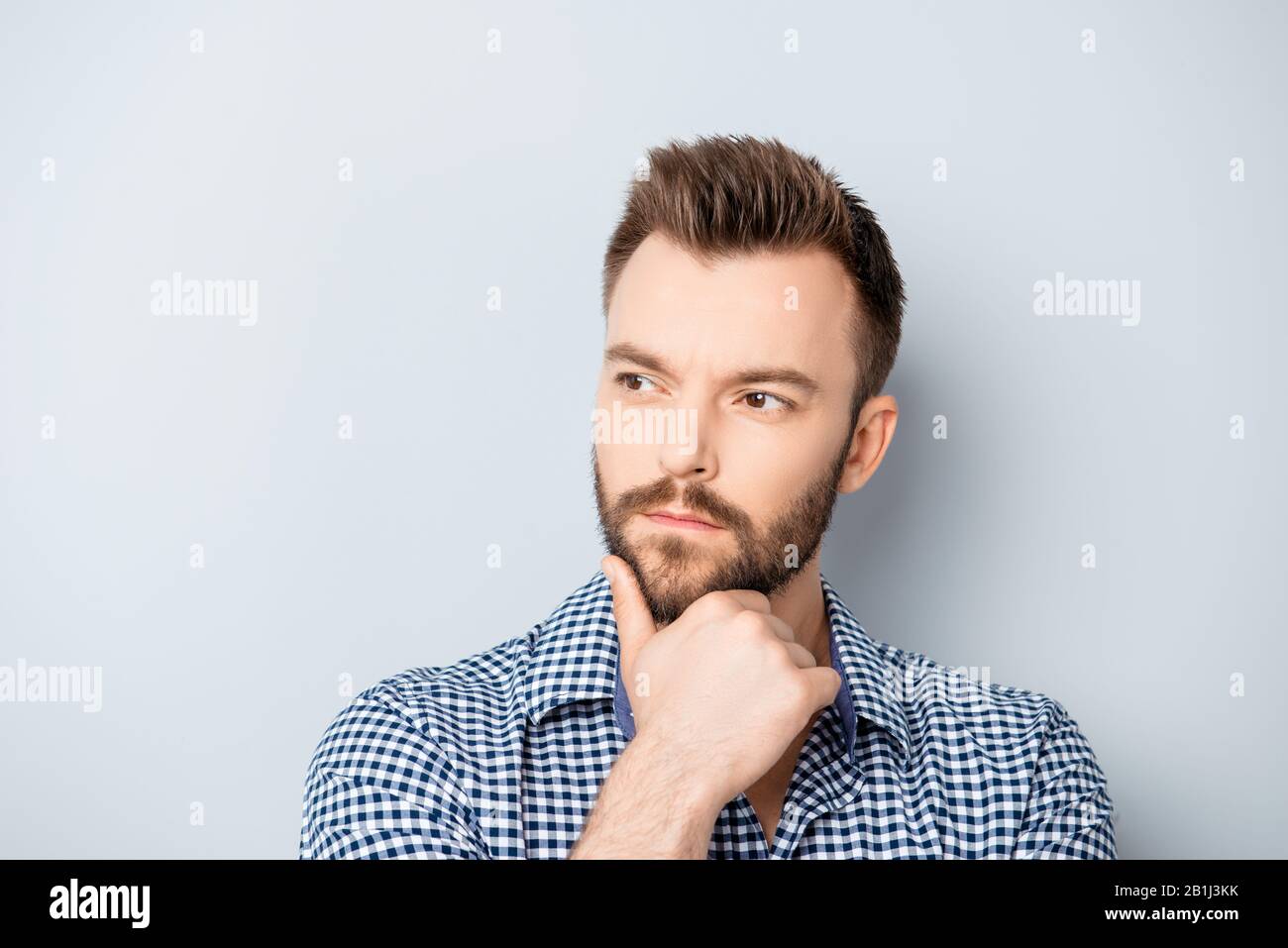 Man touching chin hi-res stock photography and images - Alamy