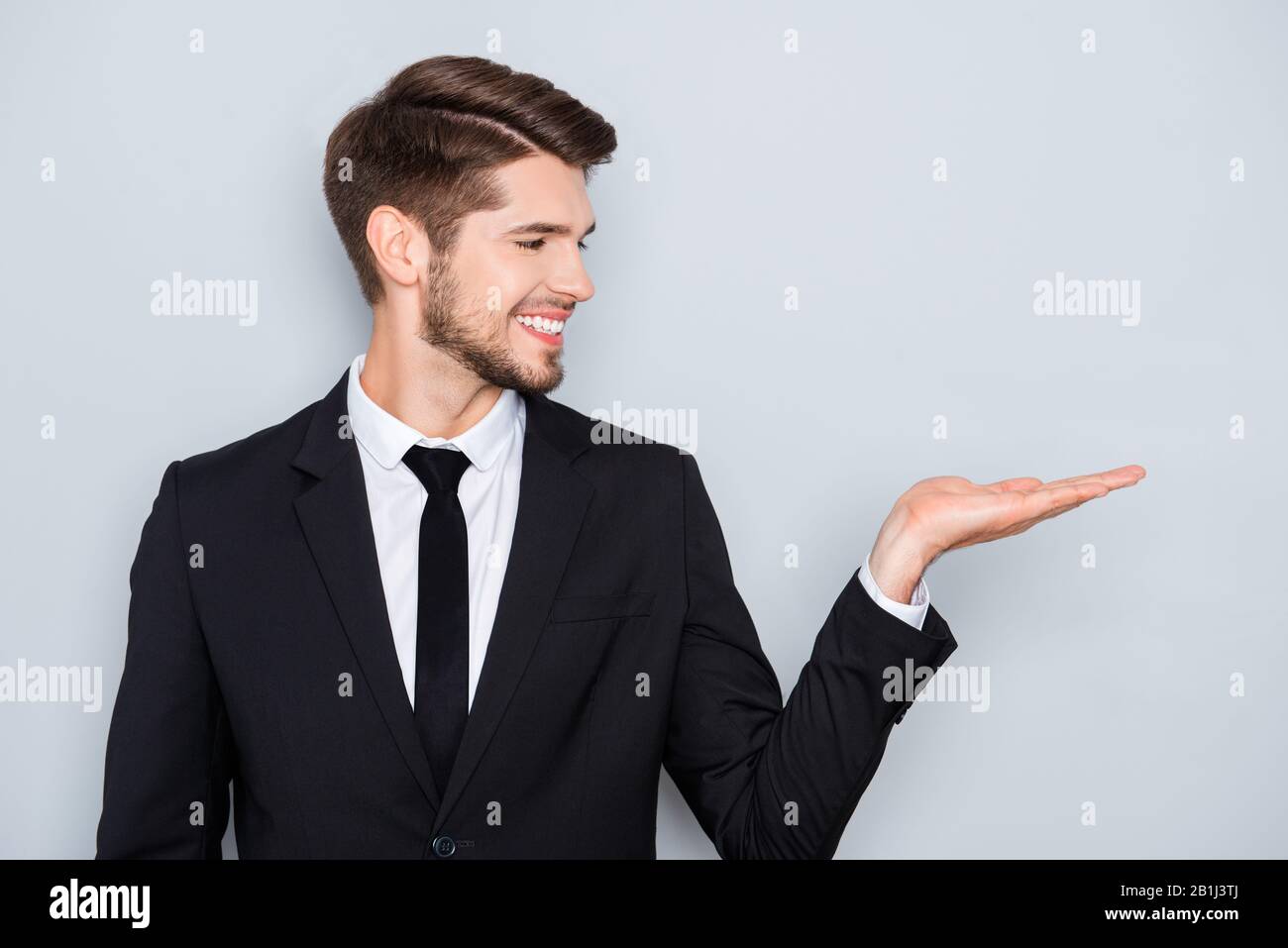 Portrait of smiling promoter making advertisement of new product Stock ...