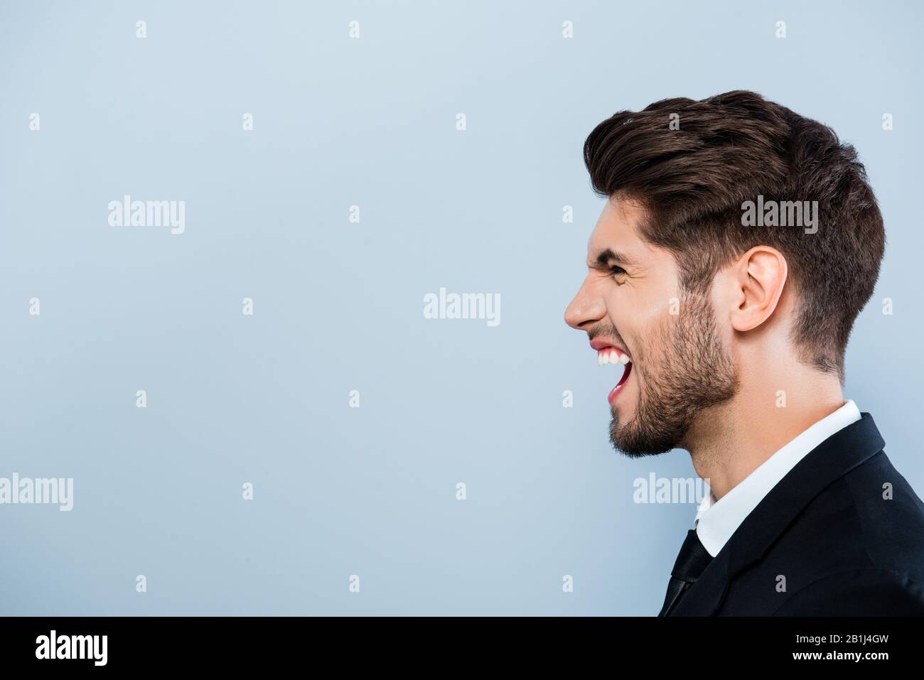 Side view of angry businessman with big problems screaming Stock Photo ...