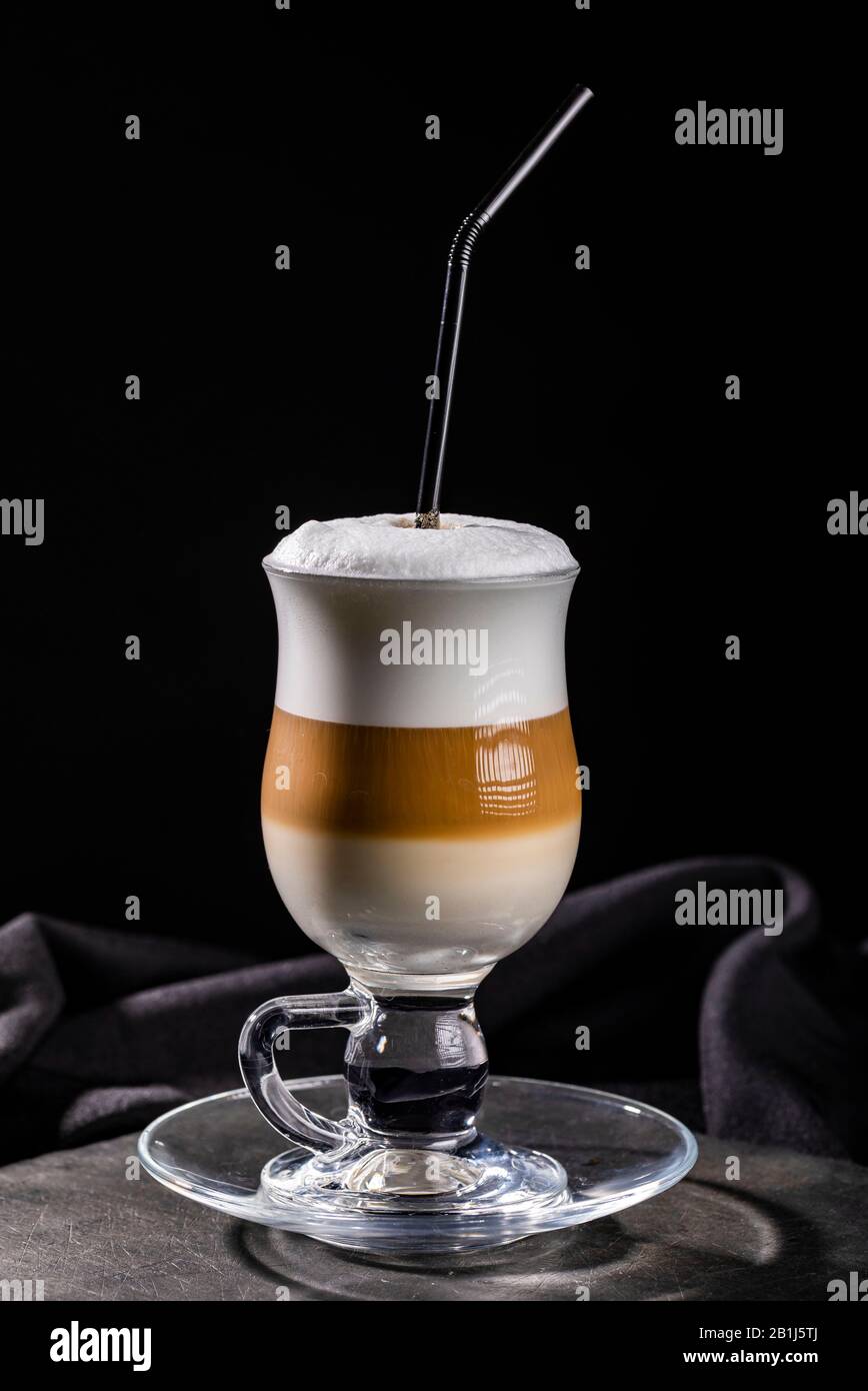 Multilayer coffee isolated on black Stock Photo - Alamy