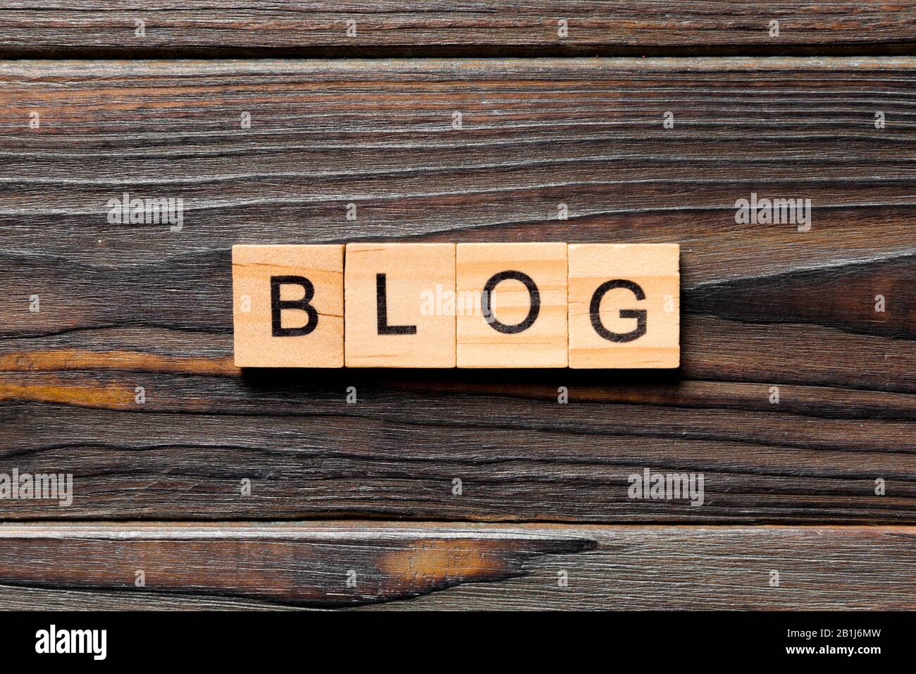 BLOG word written on wood block. BLOG text on wooden table for your ...