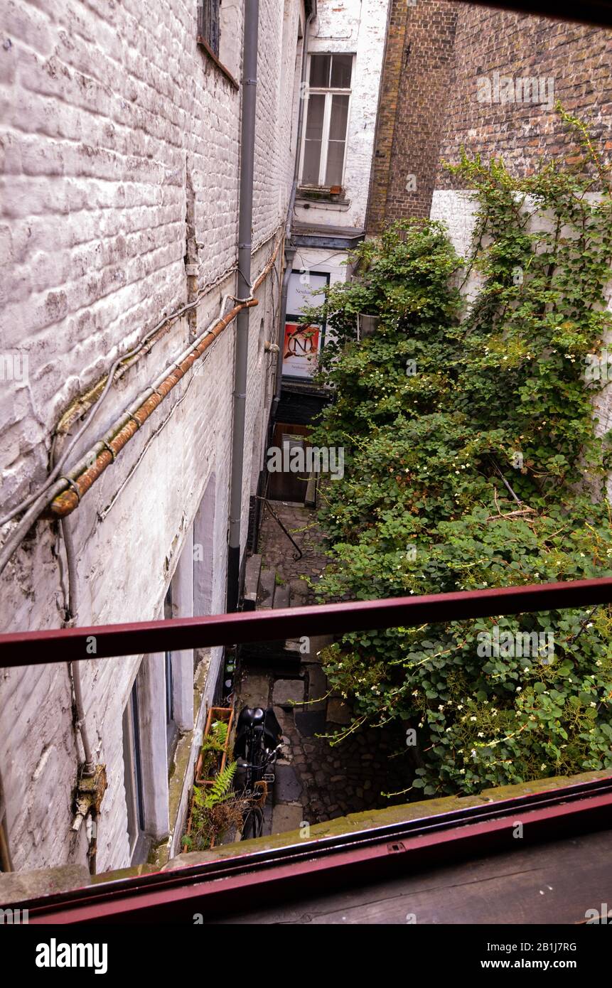 Bruges, flanders, Belgium. August 2019. View on the skimpy alley that ...