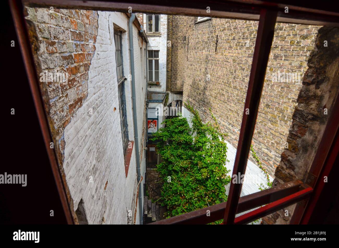 Bruges, flanders, Belgium. August 2019. View on the skimpy alley that ...