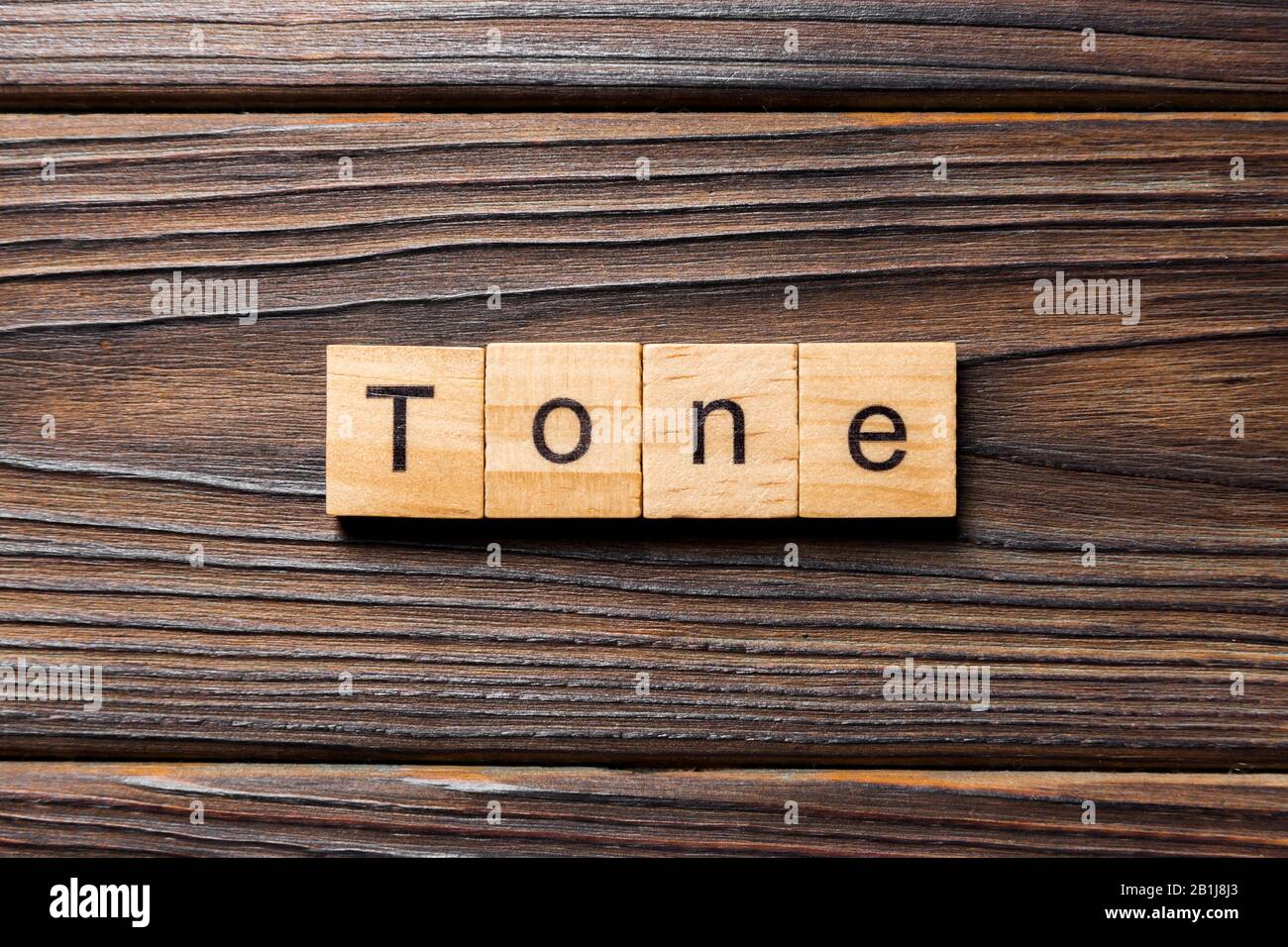 Tone Word Written On Wood Block Tone Text On Wooden Table For Your tone-word-written-on-wood-block-tone-text-on-wooden-table-for-your
