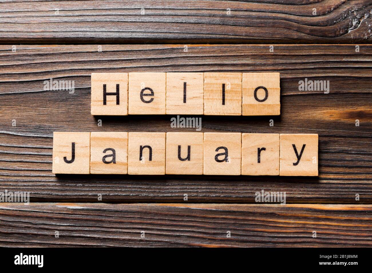 hello january word written on wood block. hello january text on table ...